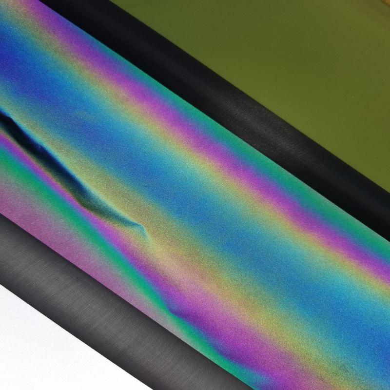 网红七彩反光高亮炫彩反光布彩虹夜光布炫彩风衣夹克面料反光材料-阿里巴巴