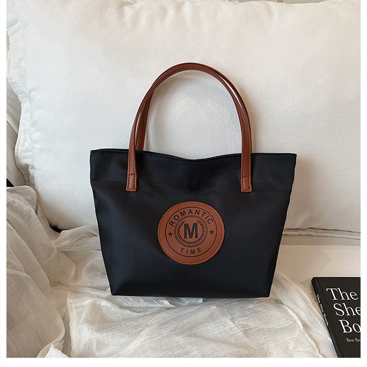 韩版时尚舒适背包2025秋季新款跨境女包洋气简约帆布单肩手拎包-阿里巴巴